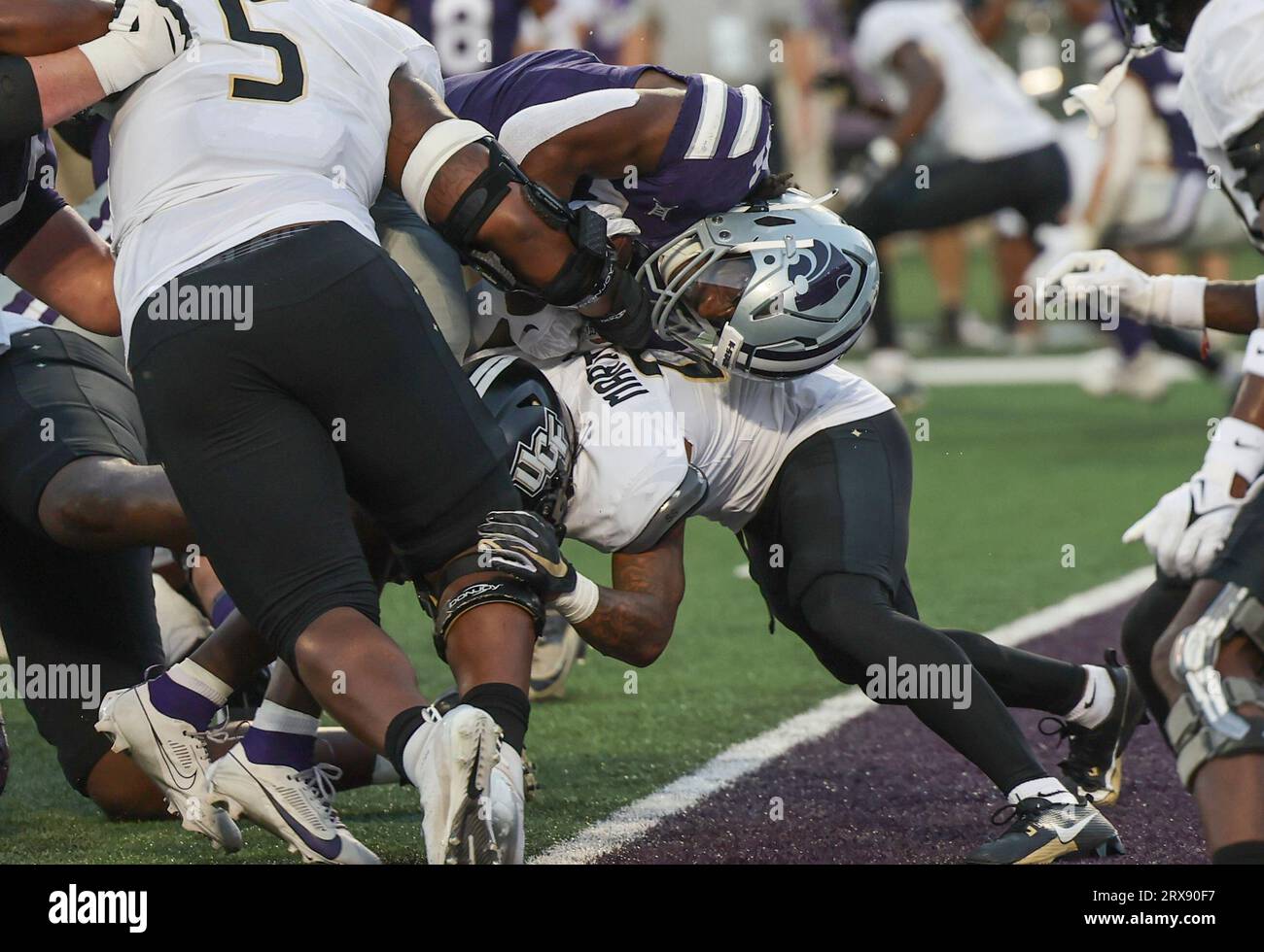 Kansas State running back DJ Giddens, top, scores a touchdown over ...