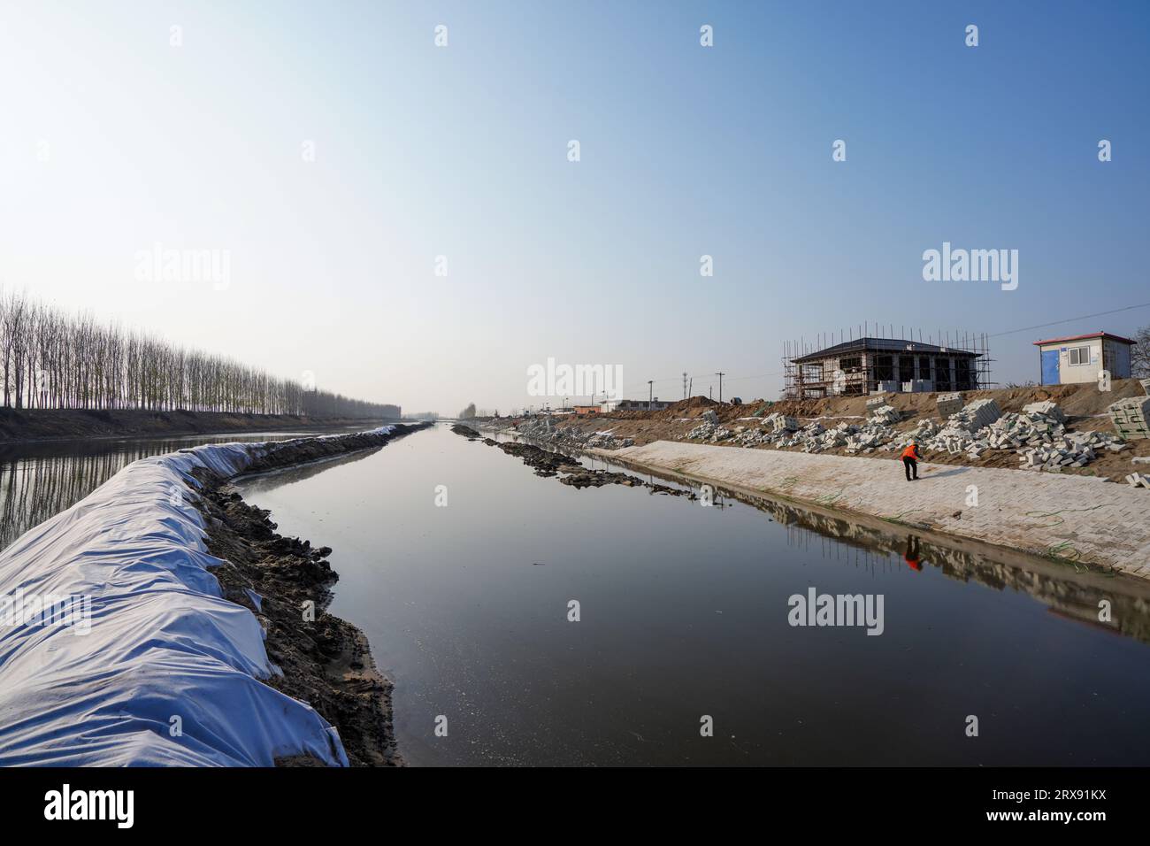 Water conservancy project construction site on the bank of the canal ...