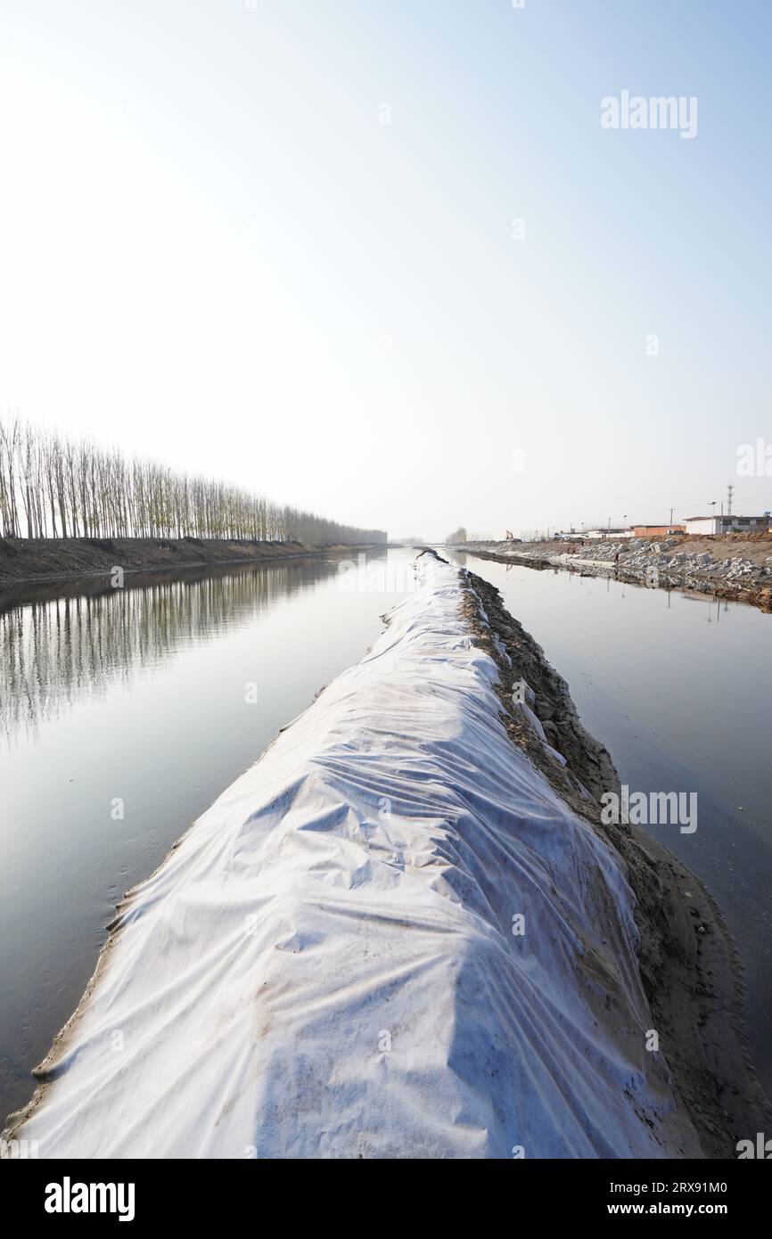 Water conservancy project construction site on the bank of the canal ...