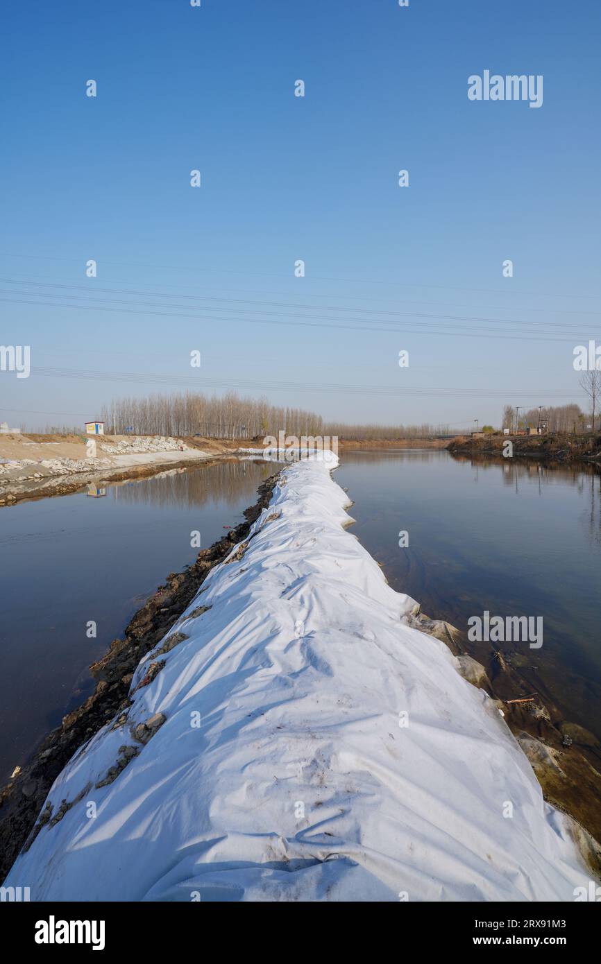 Water conservancy project construction site on the bank of the canal ...