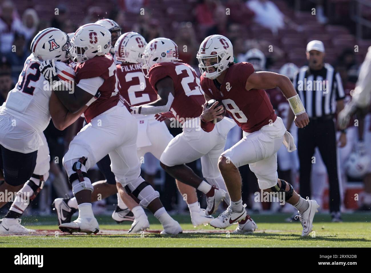 Stanford quarterback Justin Lamson, right, runs the ball against ...