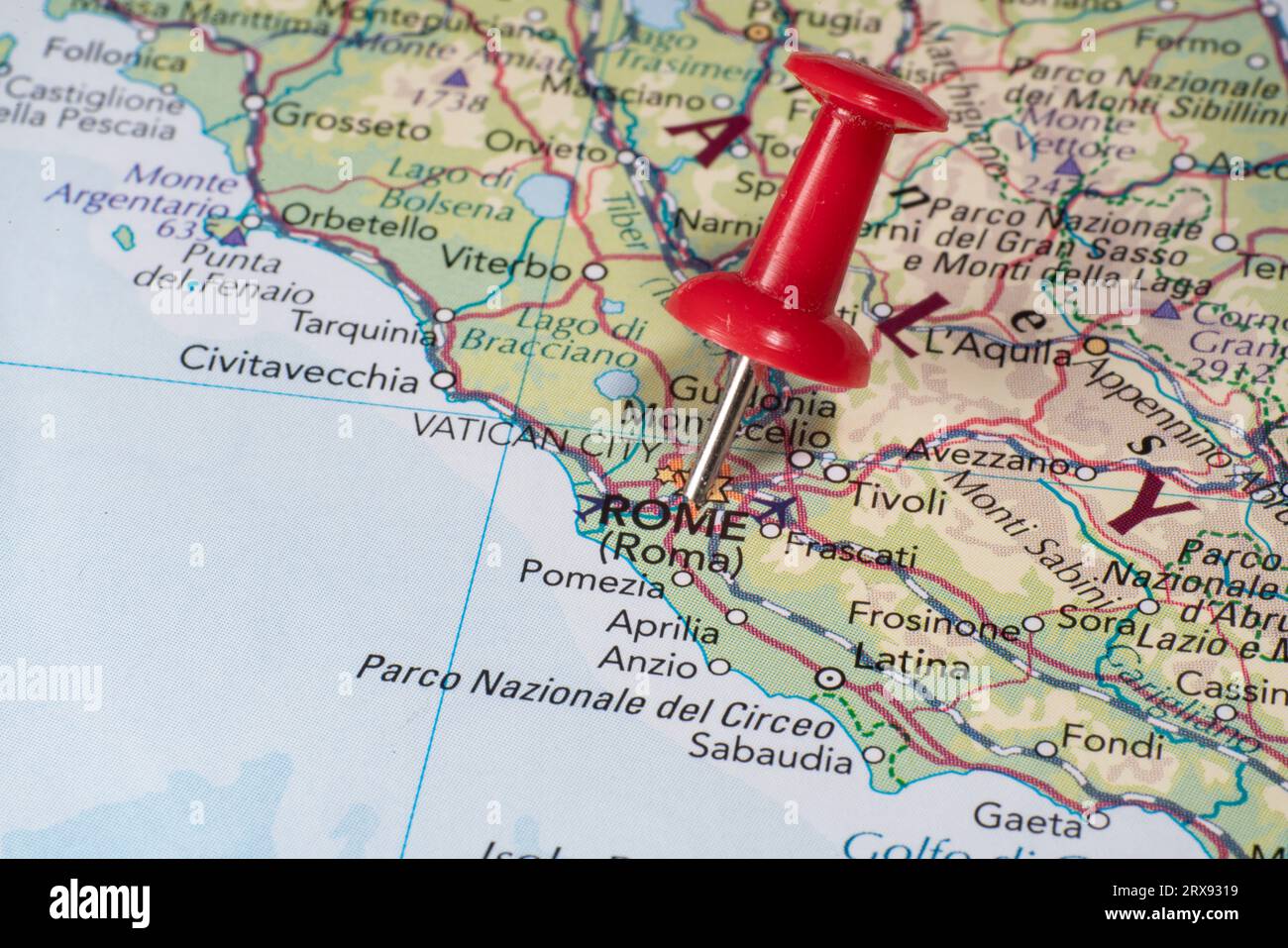 A red push in placed on a map locating Rome Italy Stock Photo - Alamy