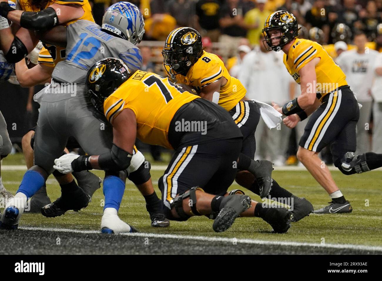 Missouri running back Nathaniel Peat (8) scores during the first half ...