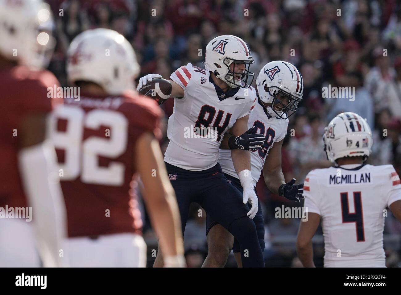 Arizona tight end Tanner McLachlan (84) celebrates with Keyan Burnett ...