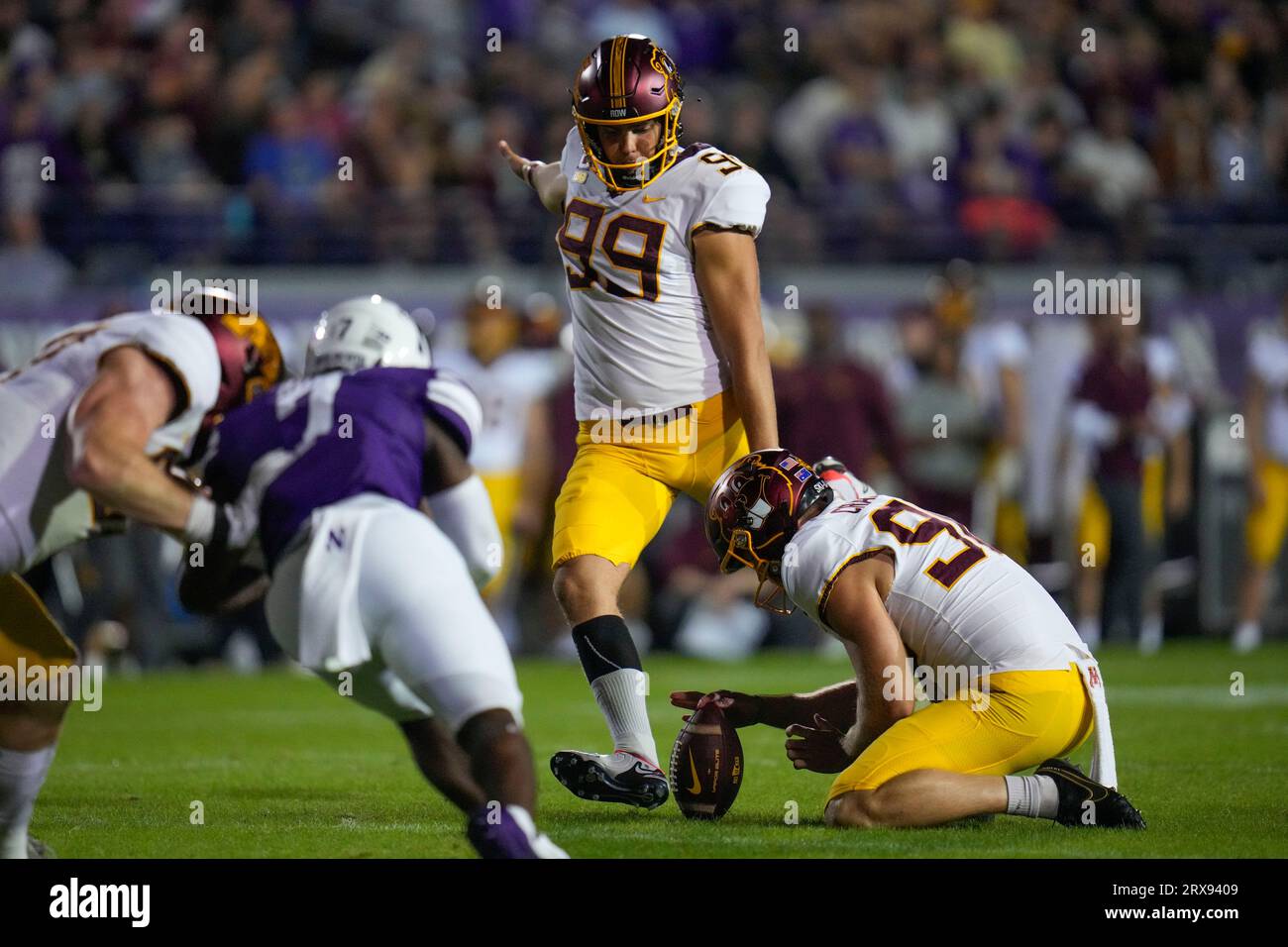 Minnesota place kicker Dragan Kesich (99) kicks a field goal against ...