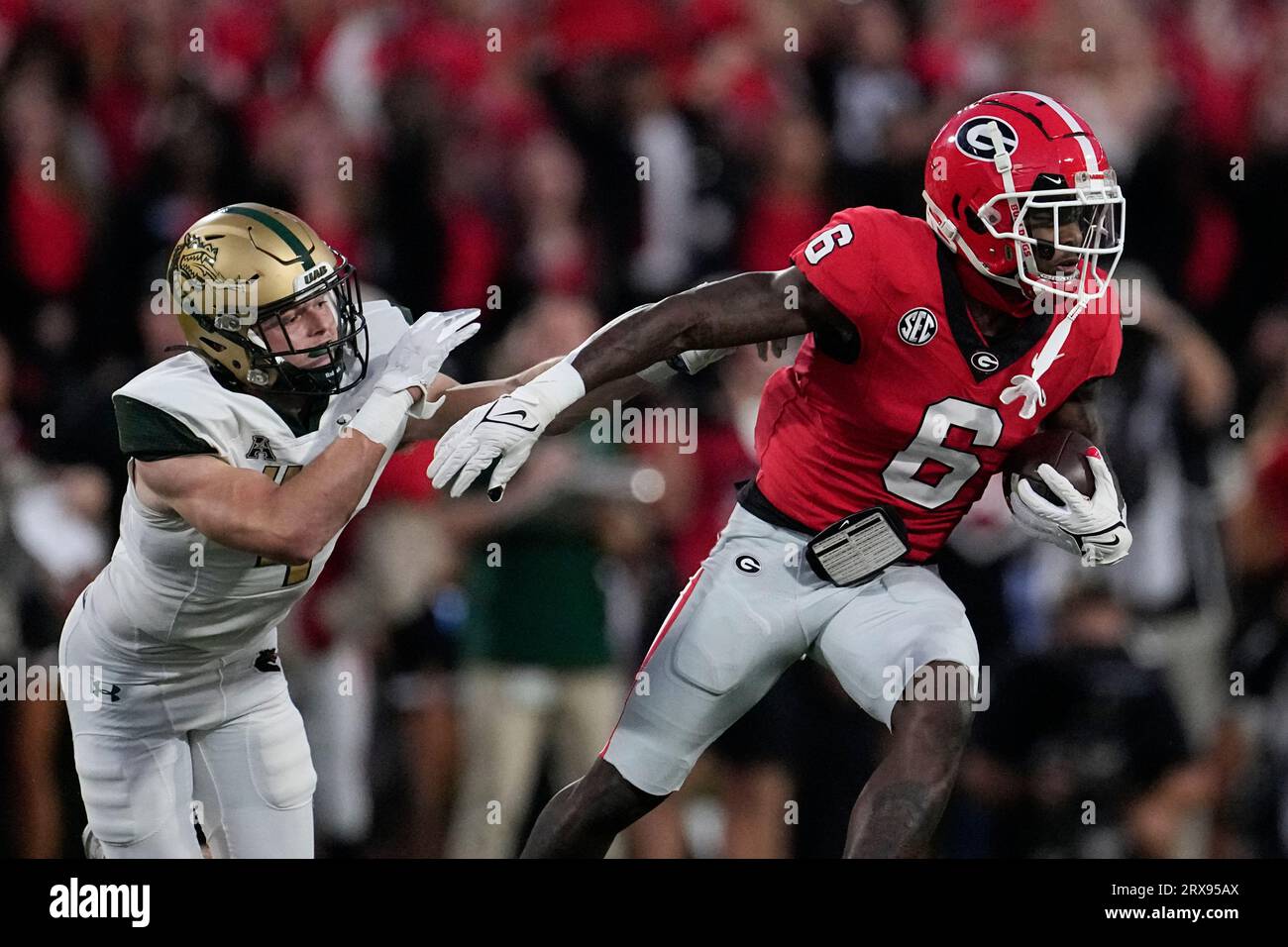 Georgia wide receiver Dominic Lovett (6) runs from UAB safety Ike ...