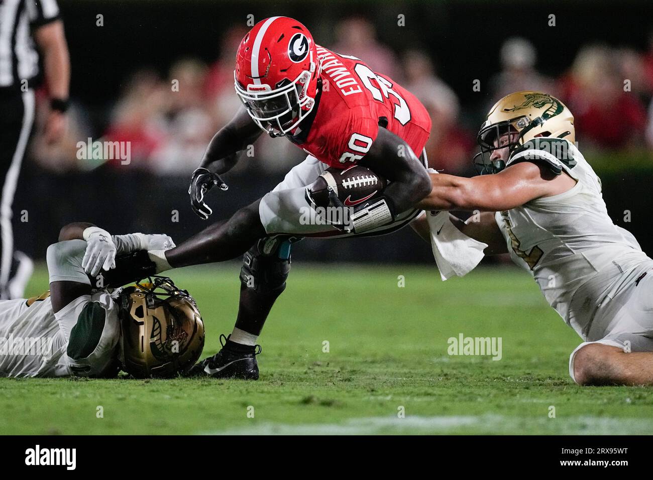 Georgia running back Daijun Edwards (30) is stopped by UAB linebackers ...