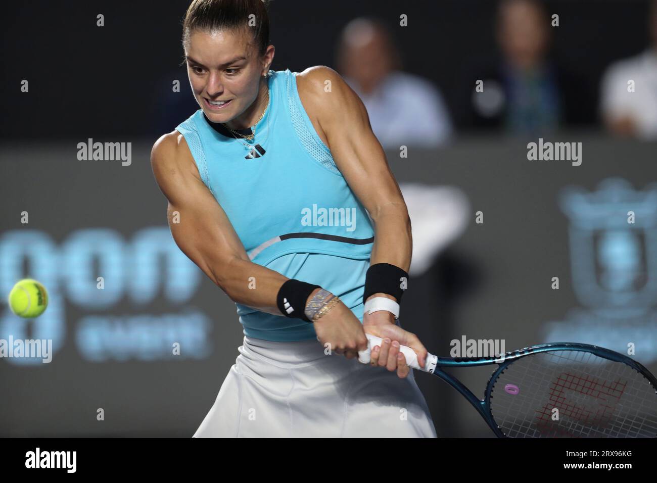 Maria Sakkari, of Greece, returns a shot to Caroline Dolehide of the U ...