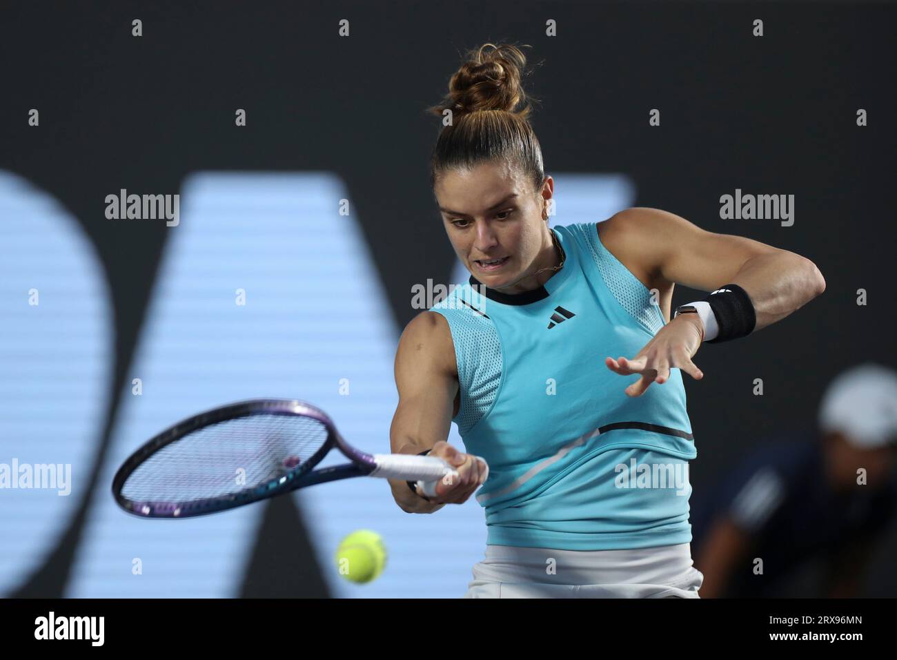 Maria Sakkari, of Greece, returns a shot to Caroline Dolehide of the U ...