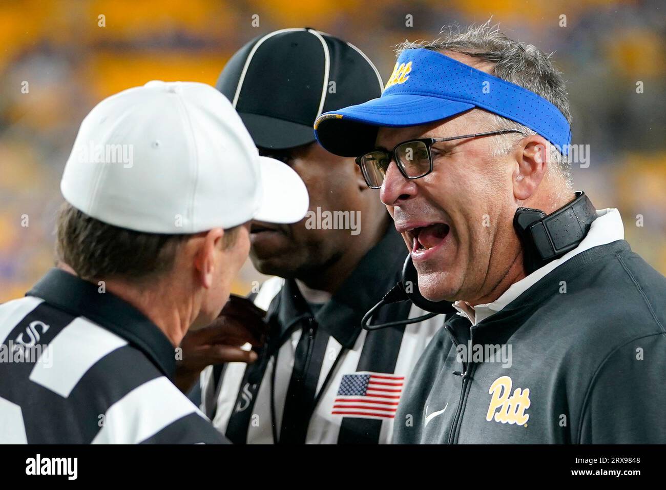 Pittsburgh head coach Pat Narduzzi, right, questions referee Stuart ...