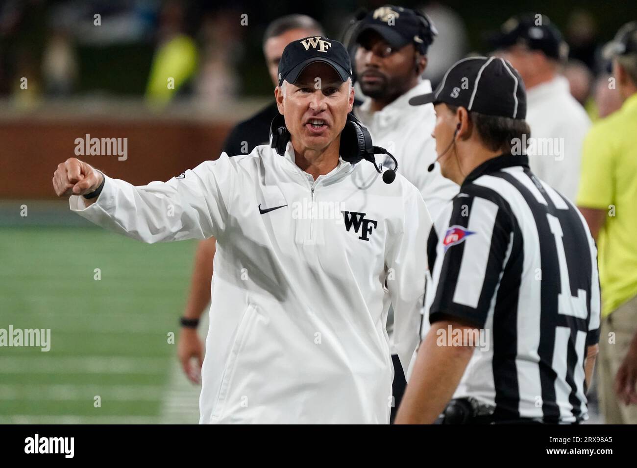 Wake Forest coach Dave Clawson, left, talks with an official during the ...