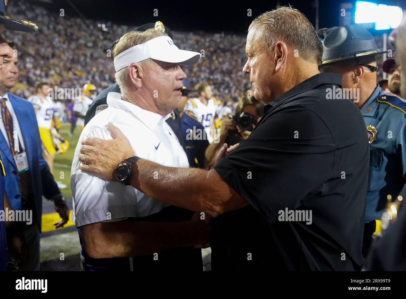 LSU head coach Brian Kelly, right, greets Arkansas head coach Sam ...