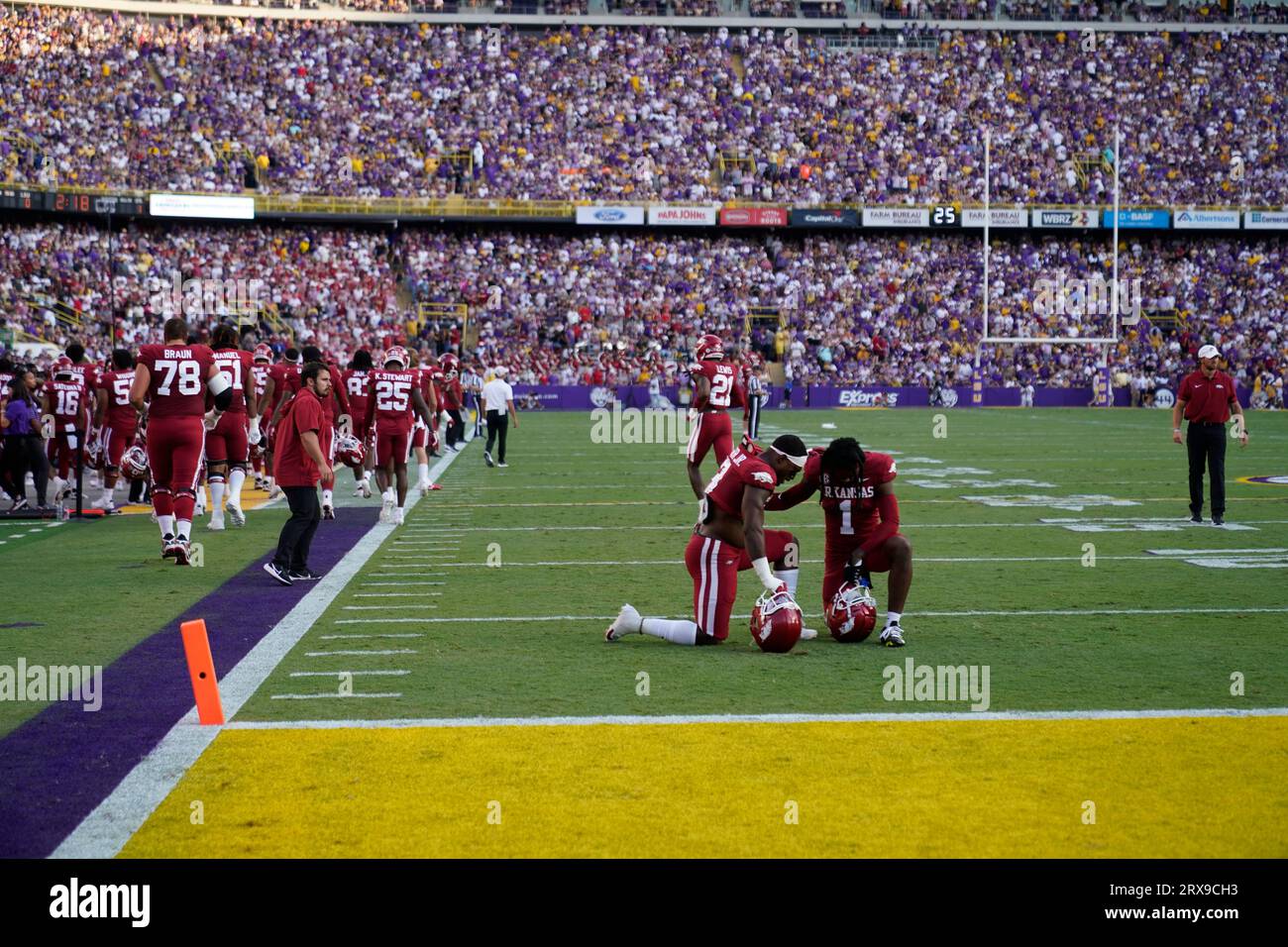 Arkansas defensive back Lorando Johnson (1) and linebacker Antonio ...