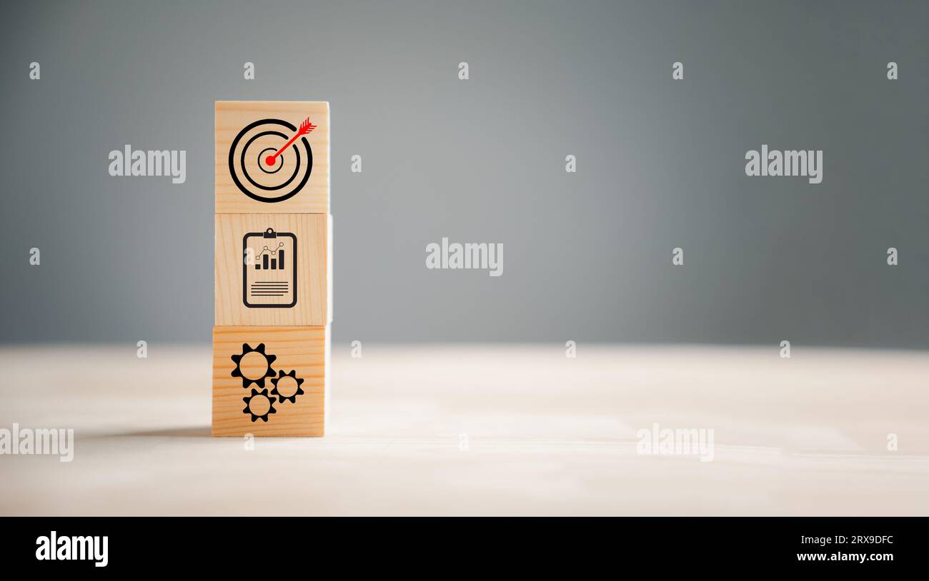 Wooden block cude step on table with Action Plan Stock Photo - Alamy