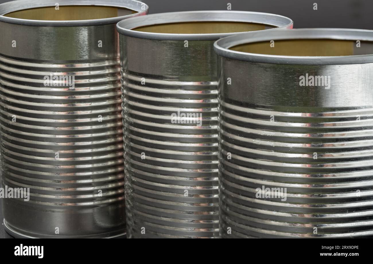 Three open empty opened Steel and tin cans arrange. Metal tin cans on ...