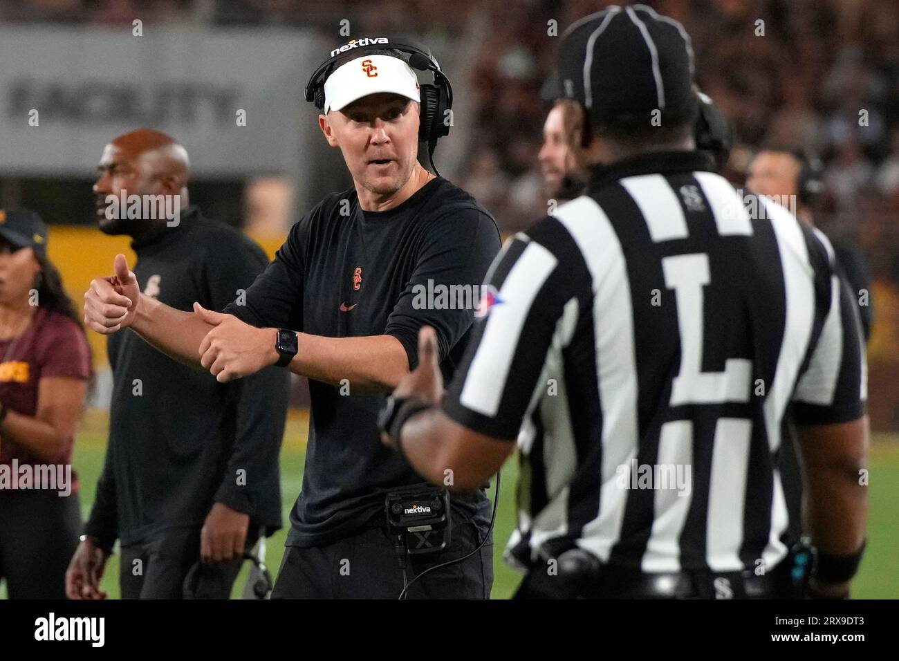 Southern California head coach Lincoln Riley, right, talks to the line ...