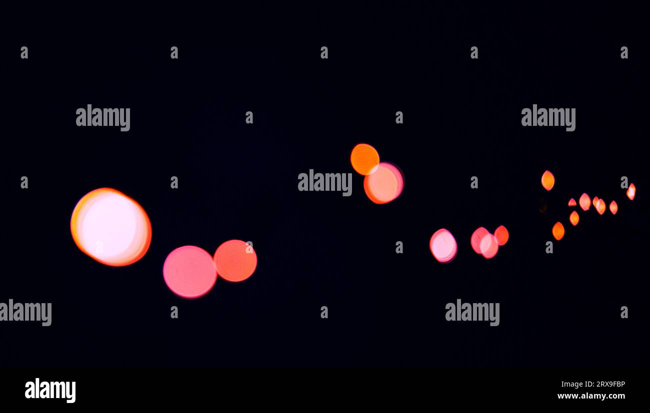 Bokeh, red color dots and black background with pattern, texture and ...