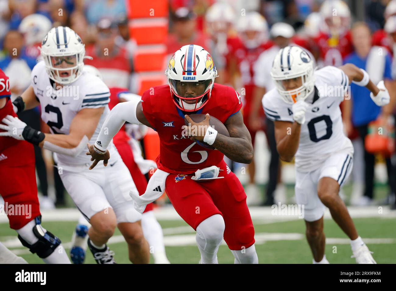 Kansas quarterback Jalon Daniels (6) runs for a first down as BYU ...