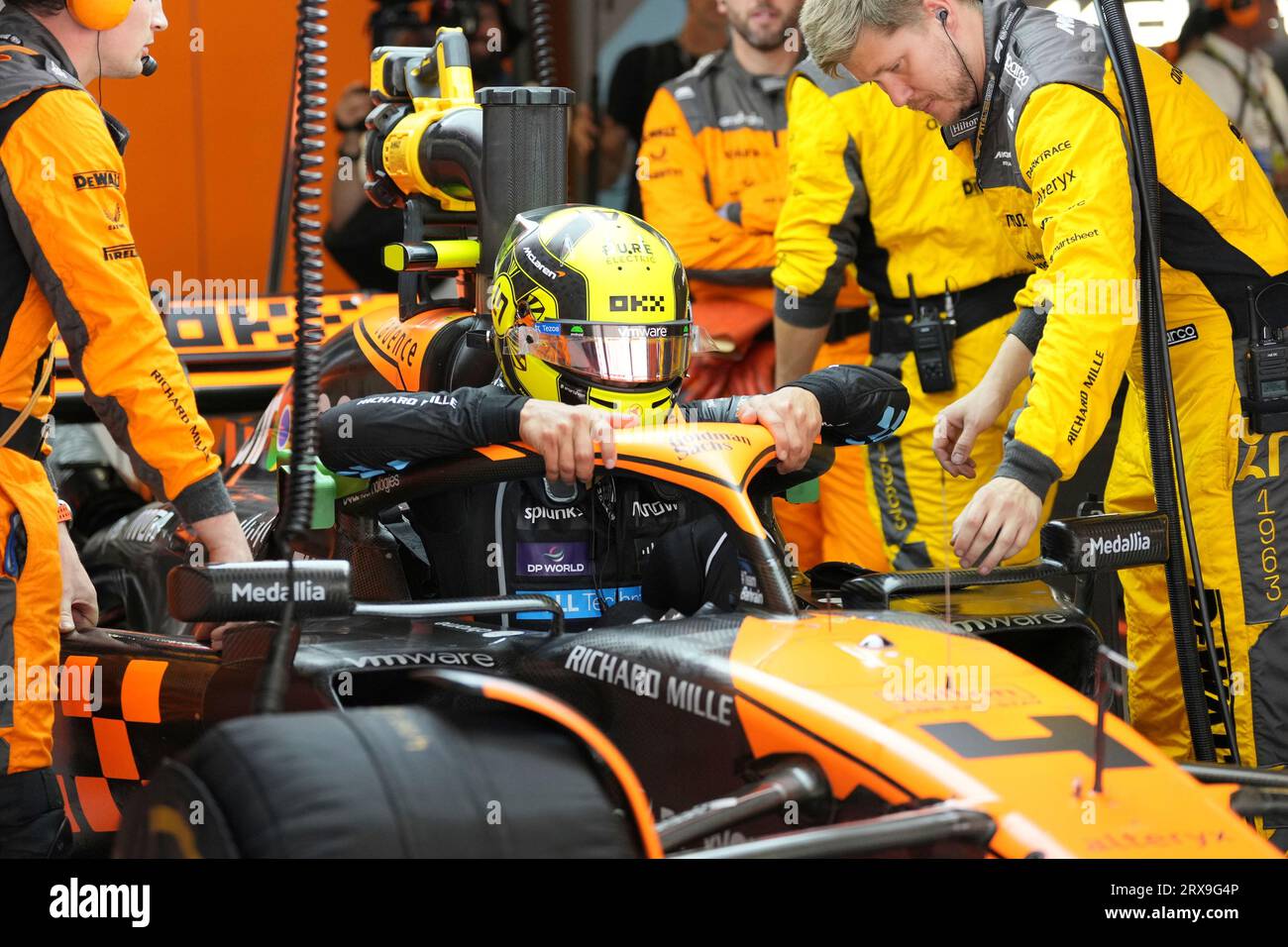 McLaren driver Lando Norris of Britain enters his car before the ...