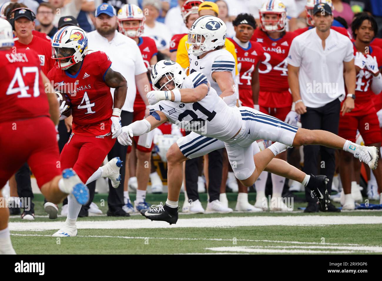 Kansas running back Devin Neal (4) gets past BYU linebacker Max Tooley ...