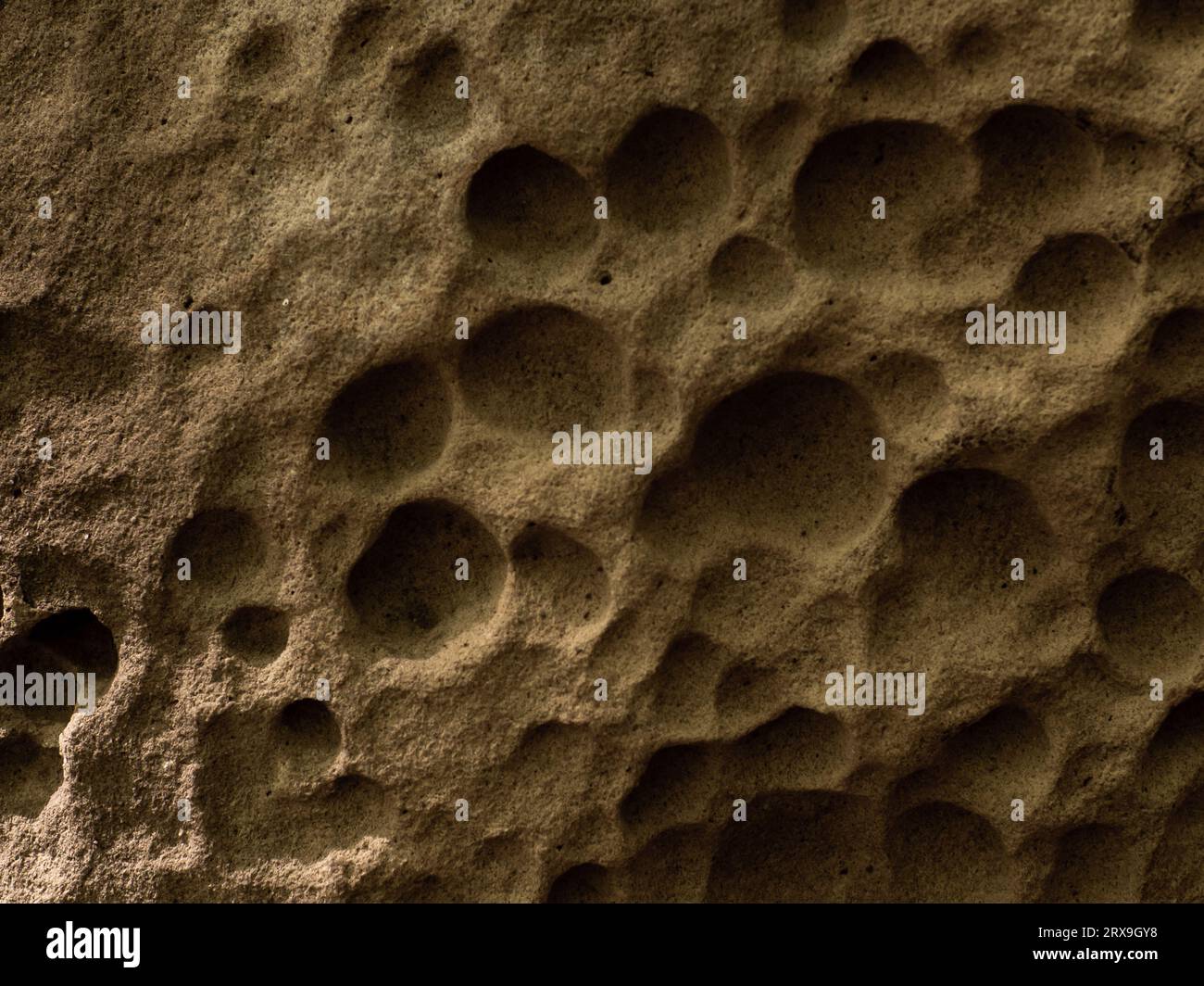 Natural stone It is shaped like a honeycomb hole. Weathered ancient ...