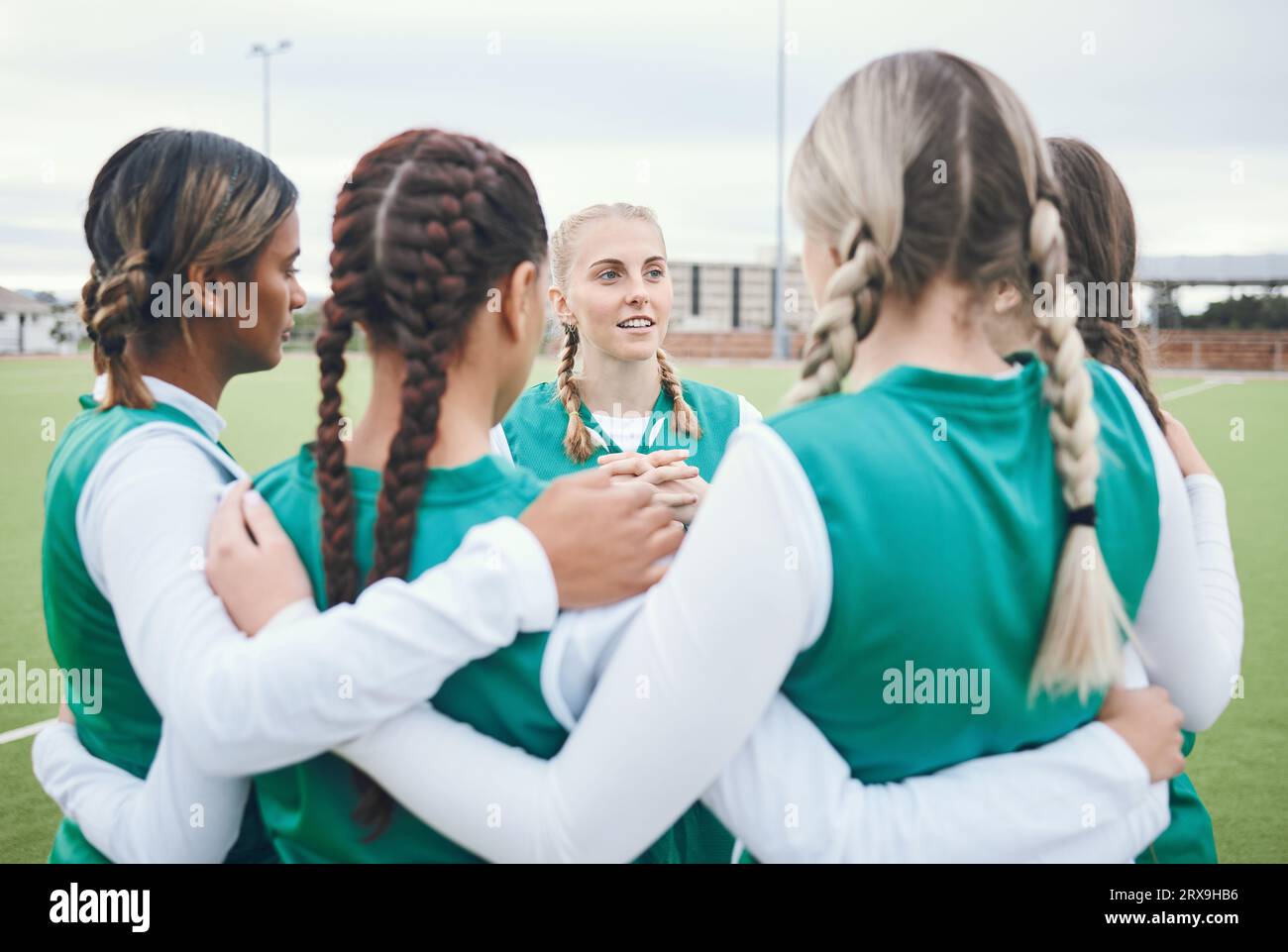 Sport, women and team in circle for meeting, solidarity and diversity on field outdoor in nature ...