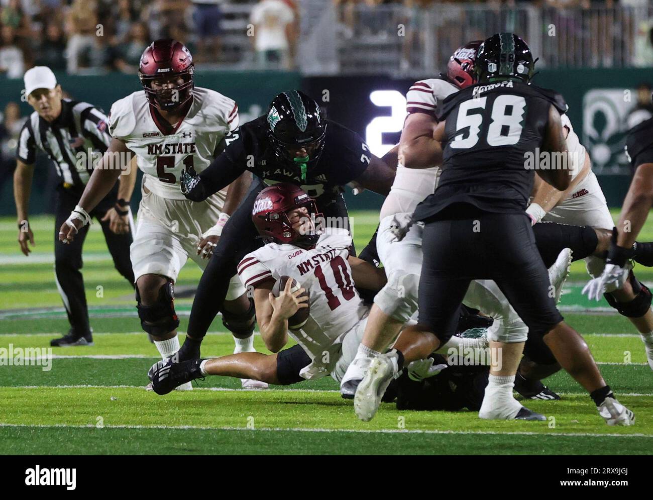 New Mexico State quarterback Diego Pavia (10) gets sacked by the Hawaii ...