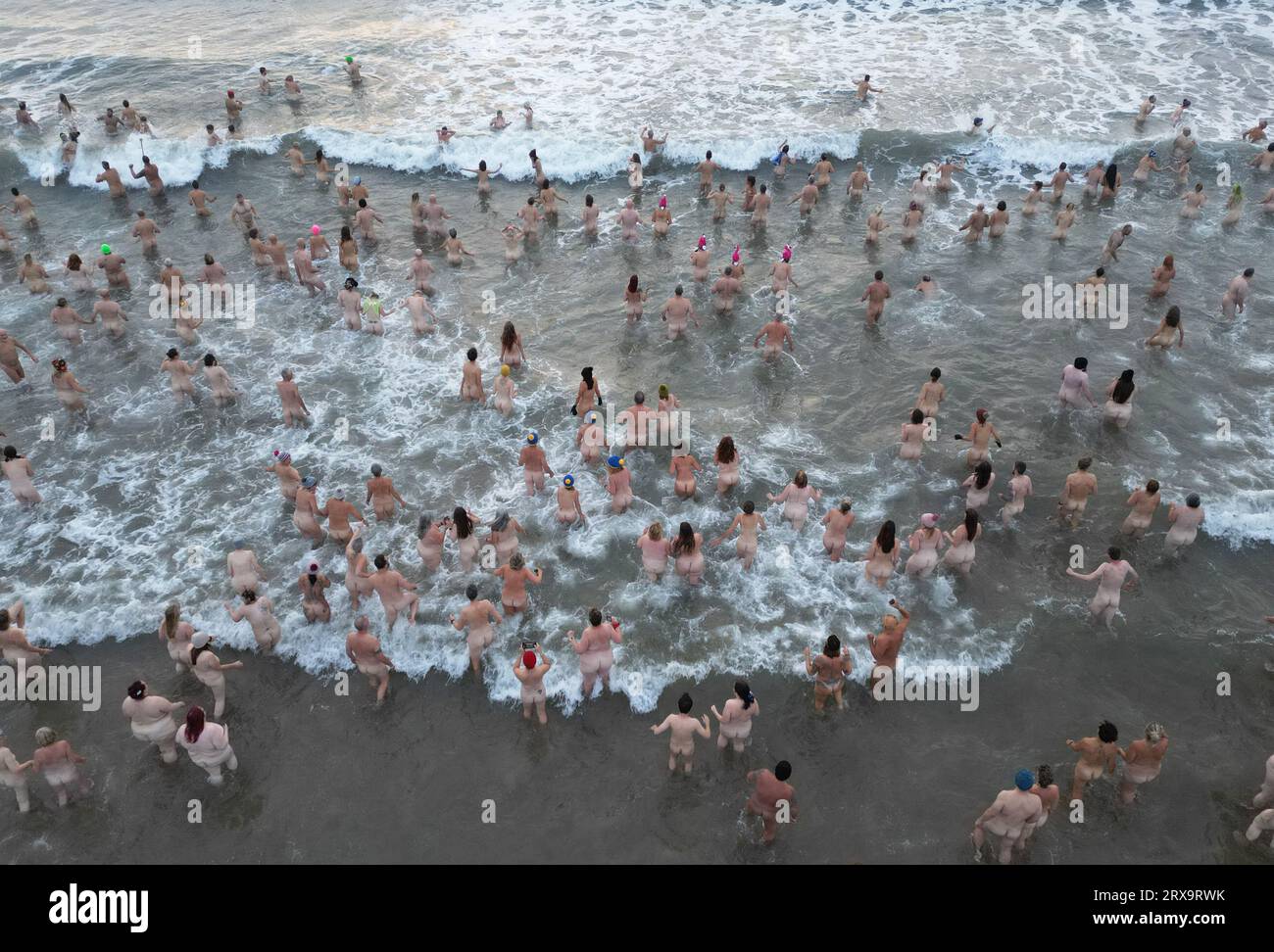 NOTE NUDITY Thousands brave the North Sea and take part in the North East Skinny Dip at Druridge ...