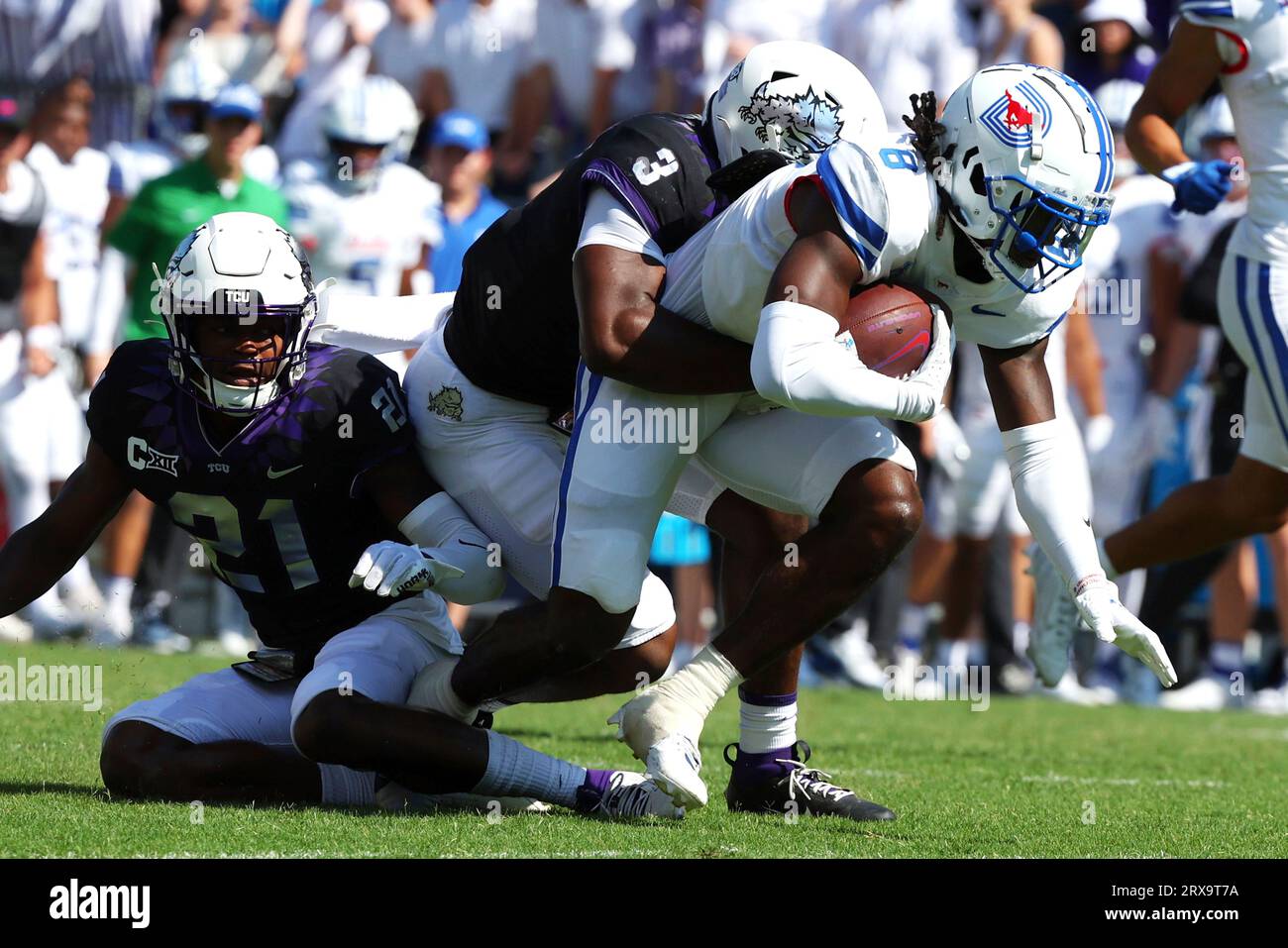 TCU safety Mark Perry (3) tackles SMU wide receiver Jordan Hudson (8 ...