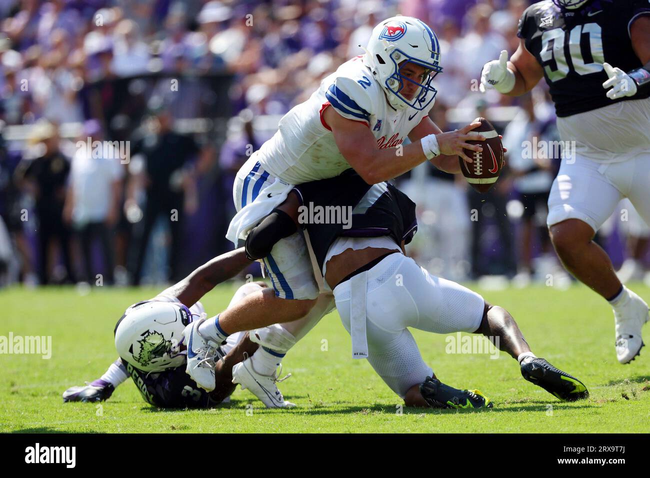 SMU quarterback Preston Stone (2) is hit by TCU cornerback Channing ...