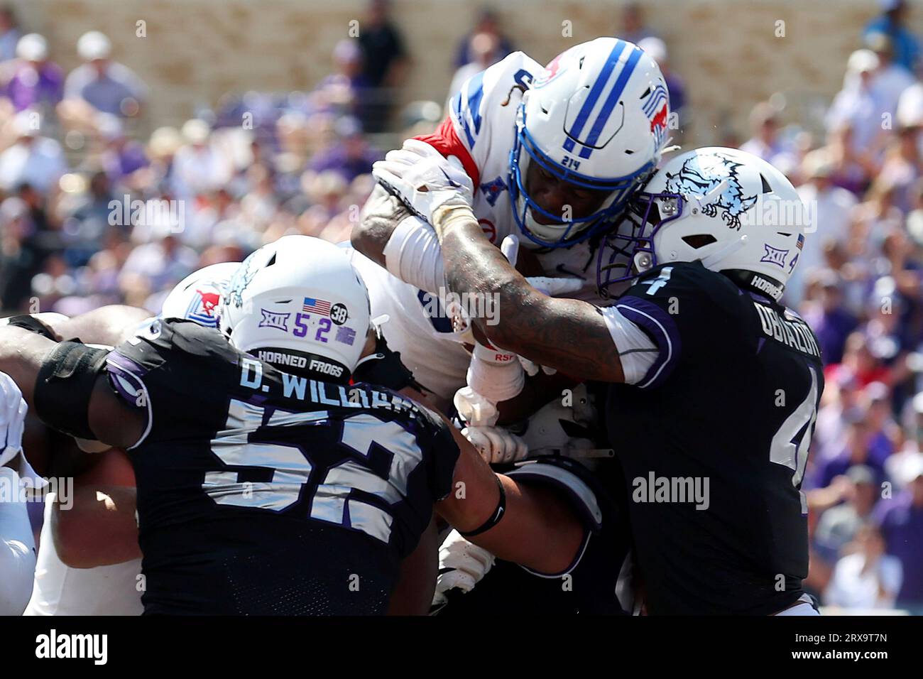 SMU running back Camar Wheaton (0) goes over the top against TCU ...
