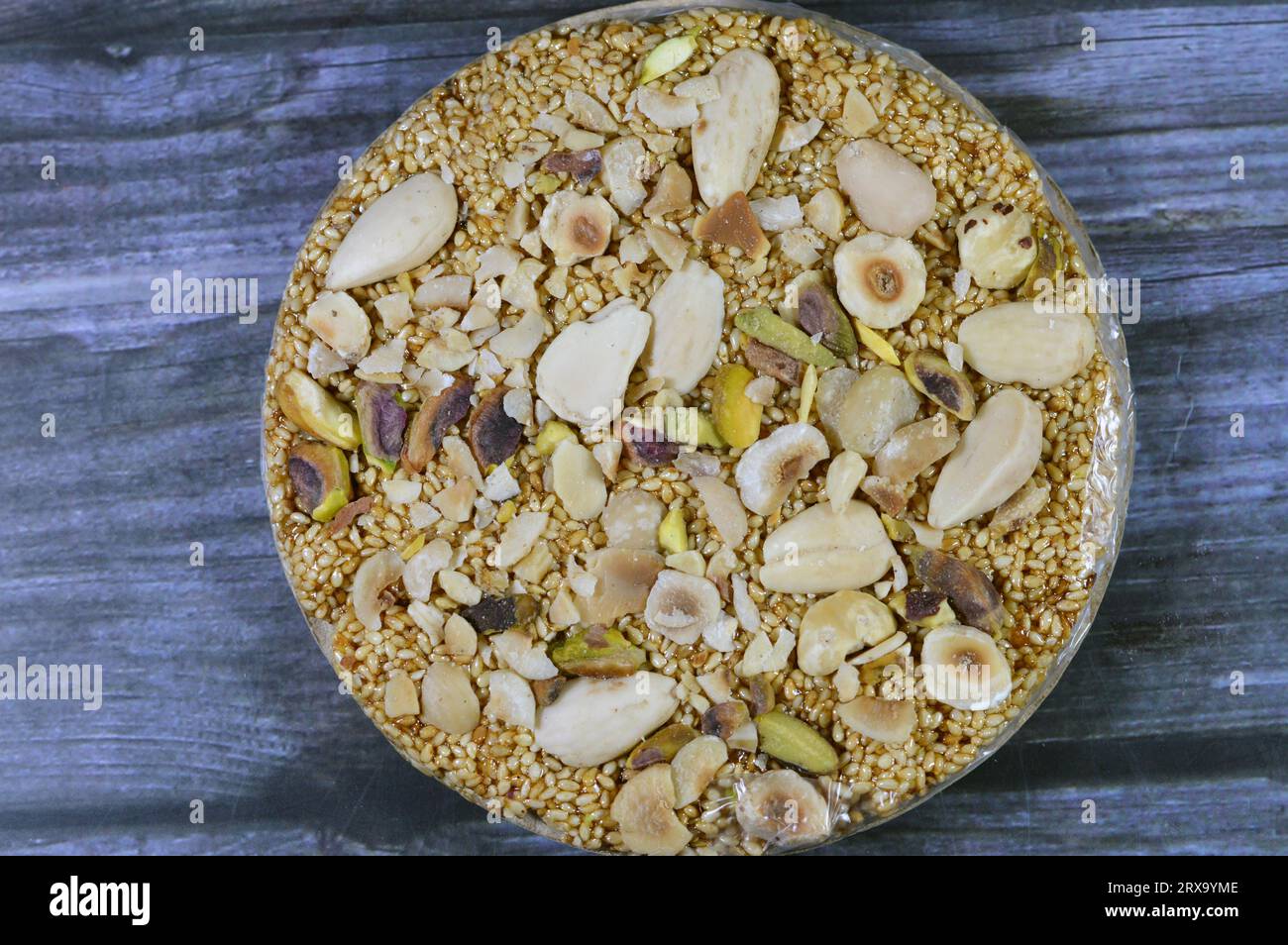 Confectionery sweet circular Eastern candy made of sugar, sesame, nuts ...