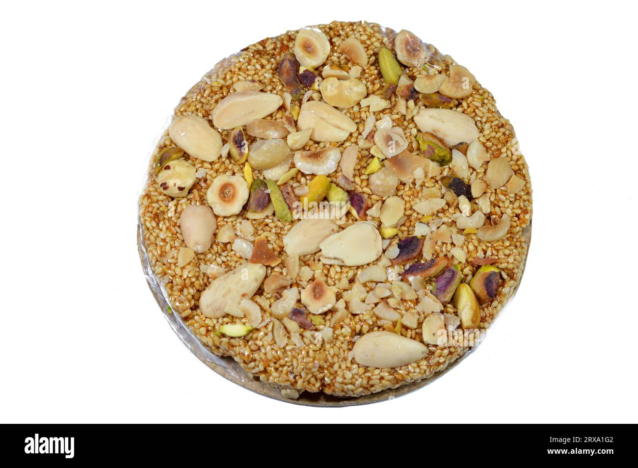 Confectionery sweet circular Eastern candy made of sugar, sesame, nuts ...
