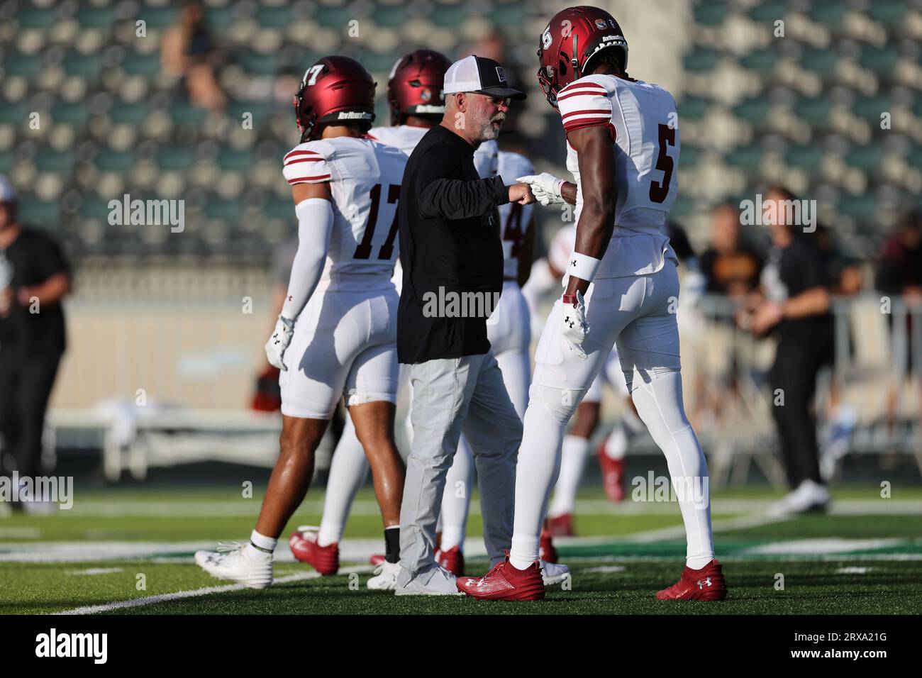 New Mexico State head coach Jerry Kill is seen on the field with New ...