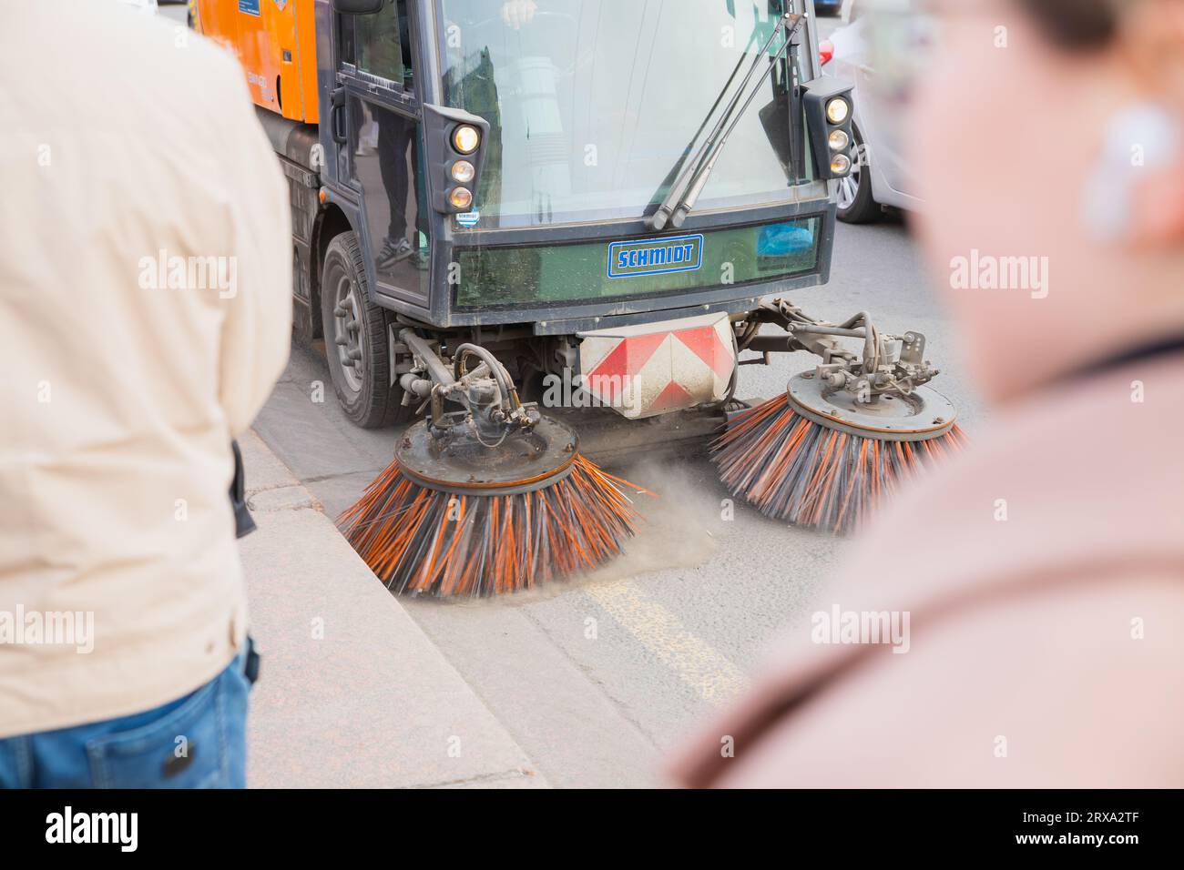 schmidt cleaning machine sweeps road asphalt in city street, sweeper ...