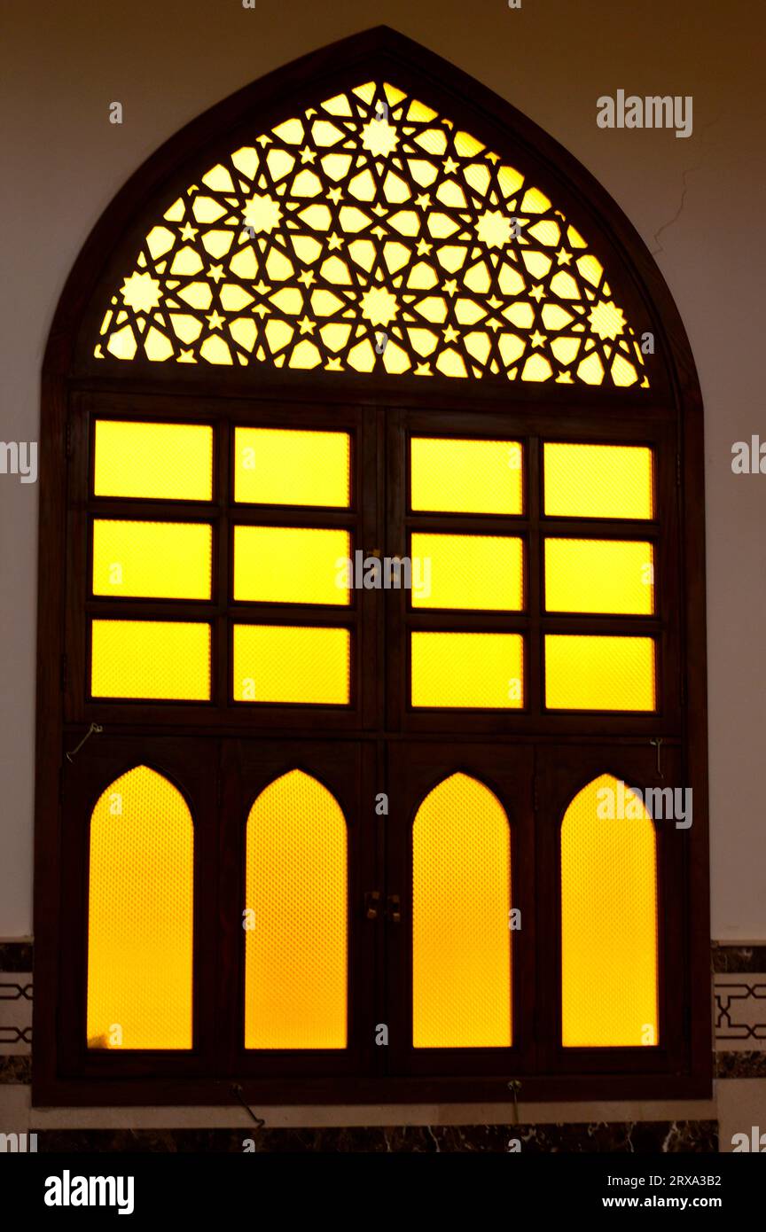 A mosque window made of wood and glass in an Islamic style, a new ...