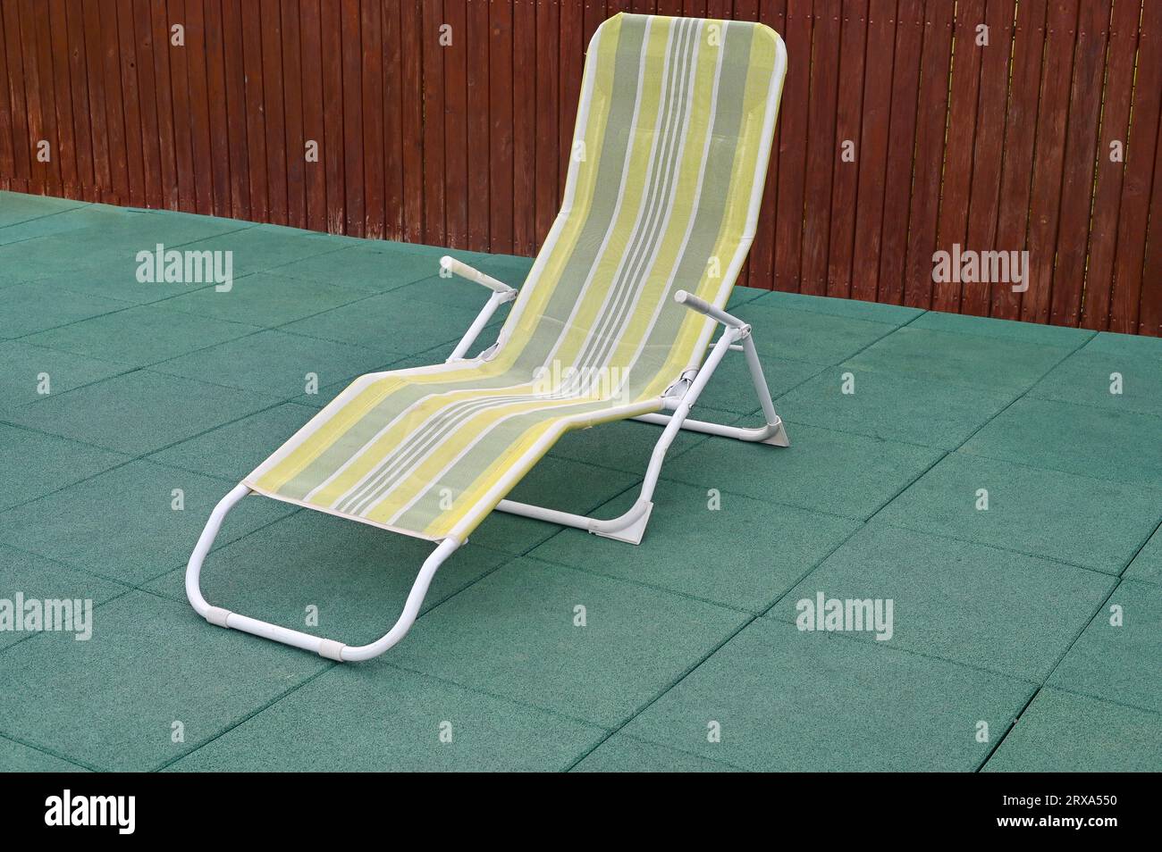 One empty deck chair or chaise longue. Concept of recreation, tanning ...