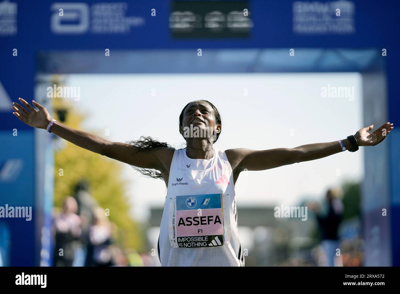 Ethiopia's Tigist Assefa celebrates as she crosses the finish line to ...
