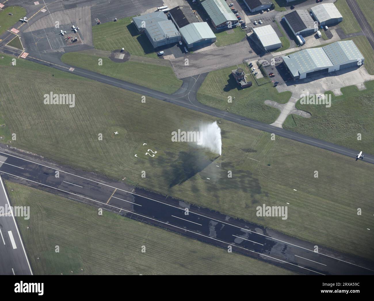 Aerial views of the Severn Trent Water Main that burst under the grass ...