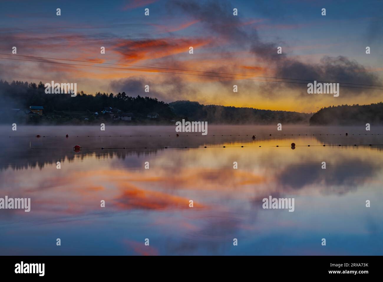 Misty lake with magic reflection Stock Photo - Alamy