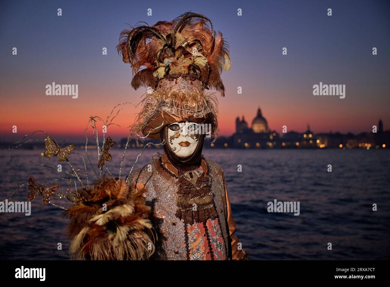 Embracing Venetian traditions as the sun sets over San Giorgio Maggiore ...