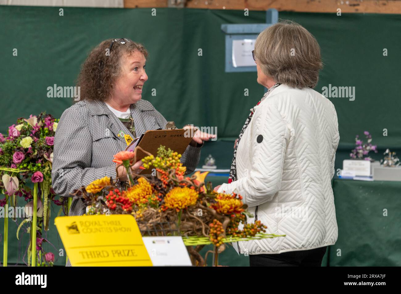 Two judges making and comparing notes at some of the many exhibits in ...