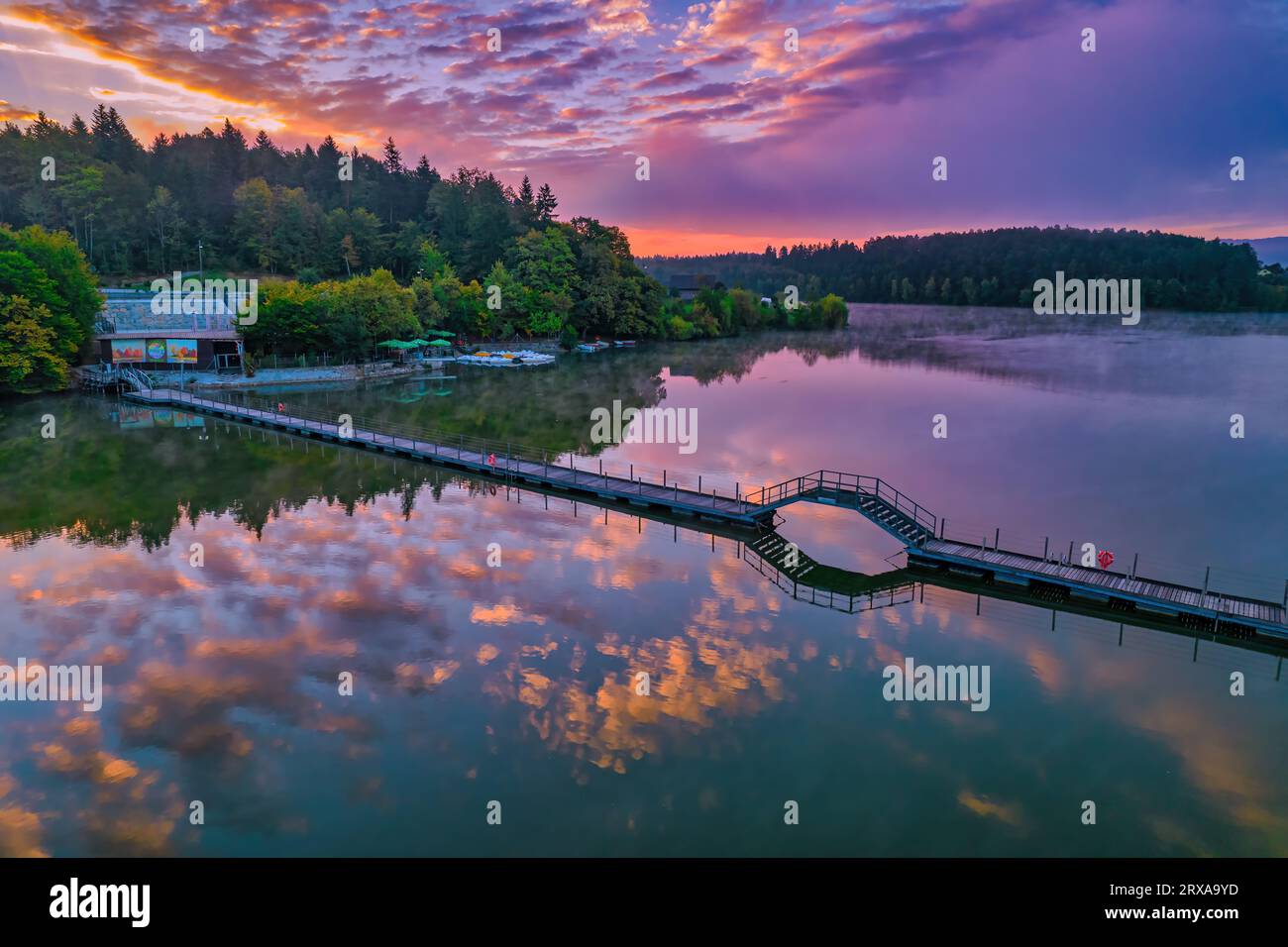 Misty lake with magic reflection Stock Photo - Alamy