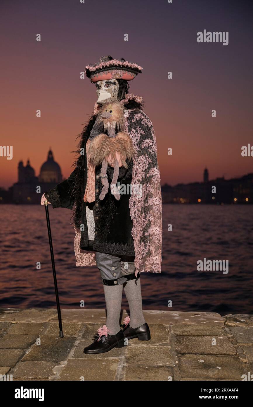 Embracing Venetian traditions as the sun sets over San Giorgio Maggiore ...