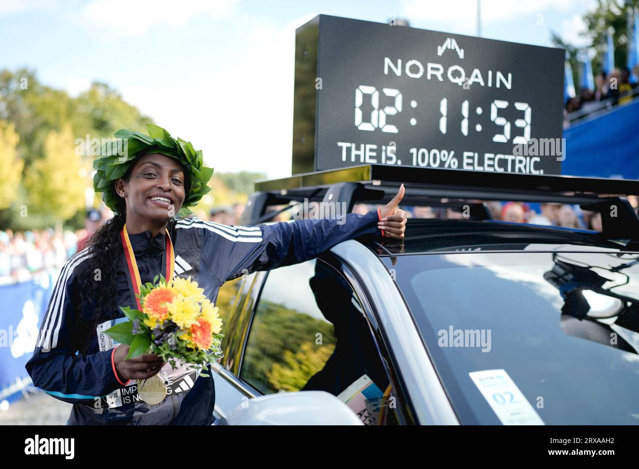 Ethiopia's Tigist Assefa celebrates near a clock with her new world ...