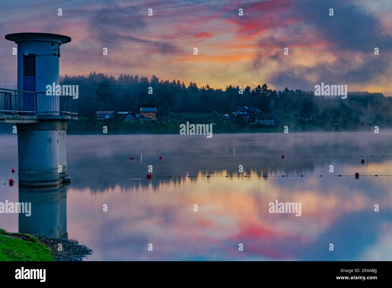 Misty lake with magic reflection Stock Photo - Alamy