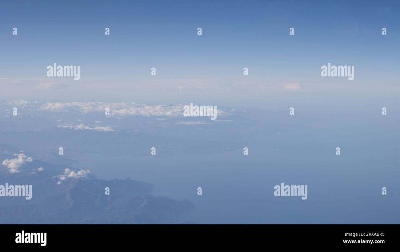 Airplane shot, flying over mountains with clouds over europe, travel ...