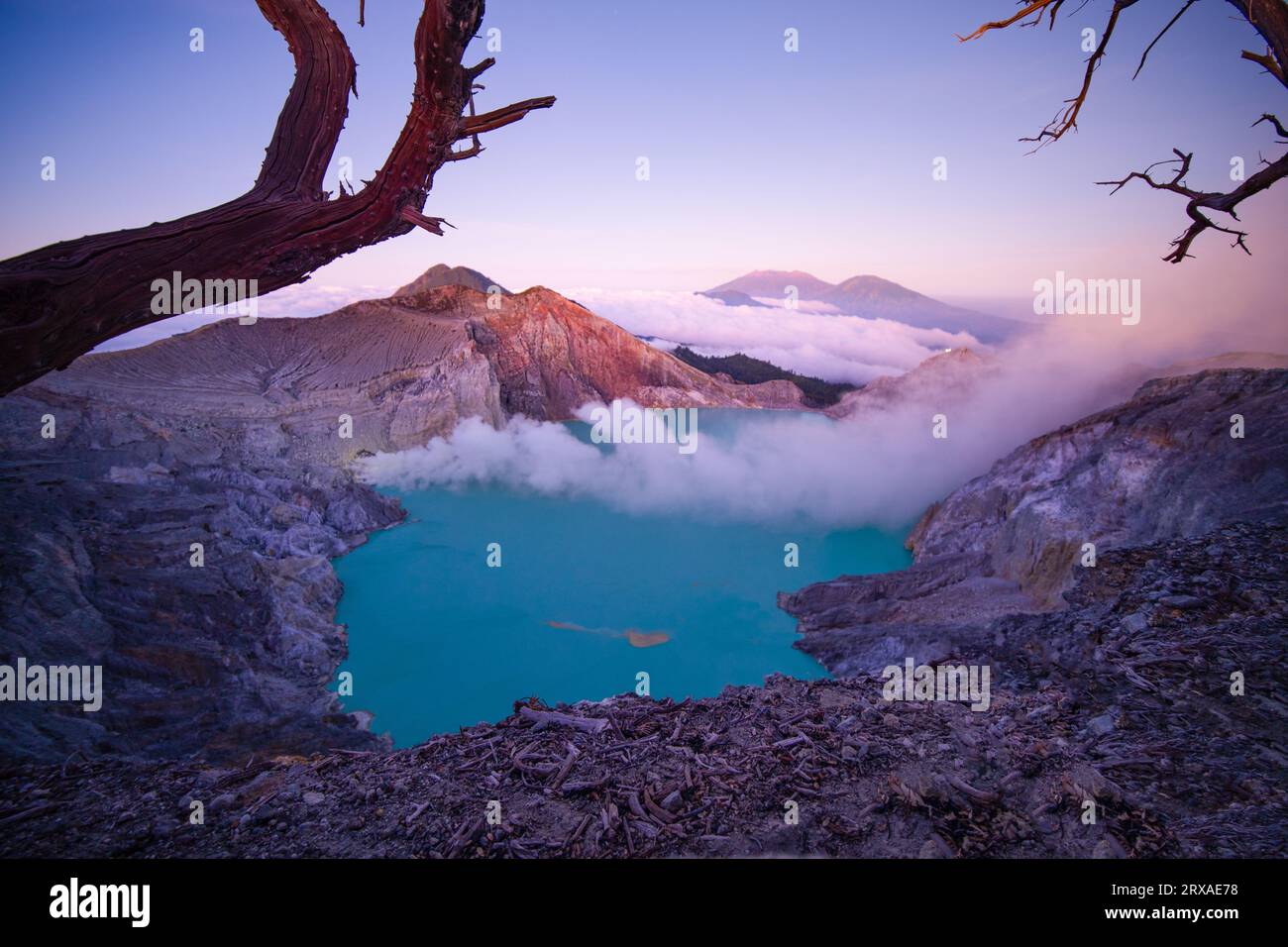 Amazing of Mountains rock cliff at Kawah Ijen volcano with turquoise sulfur water lake at ...