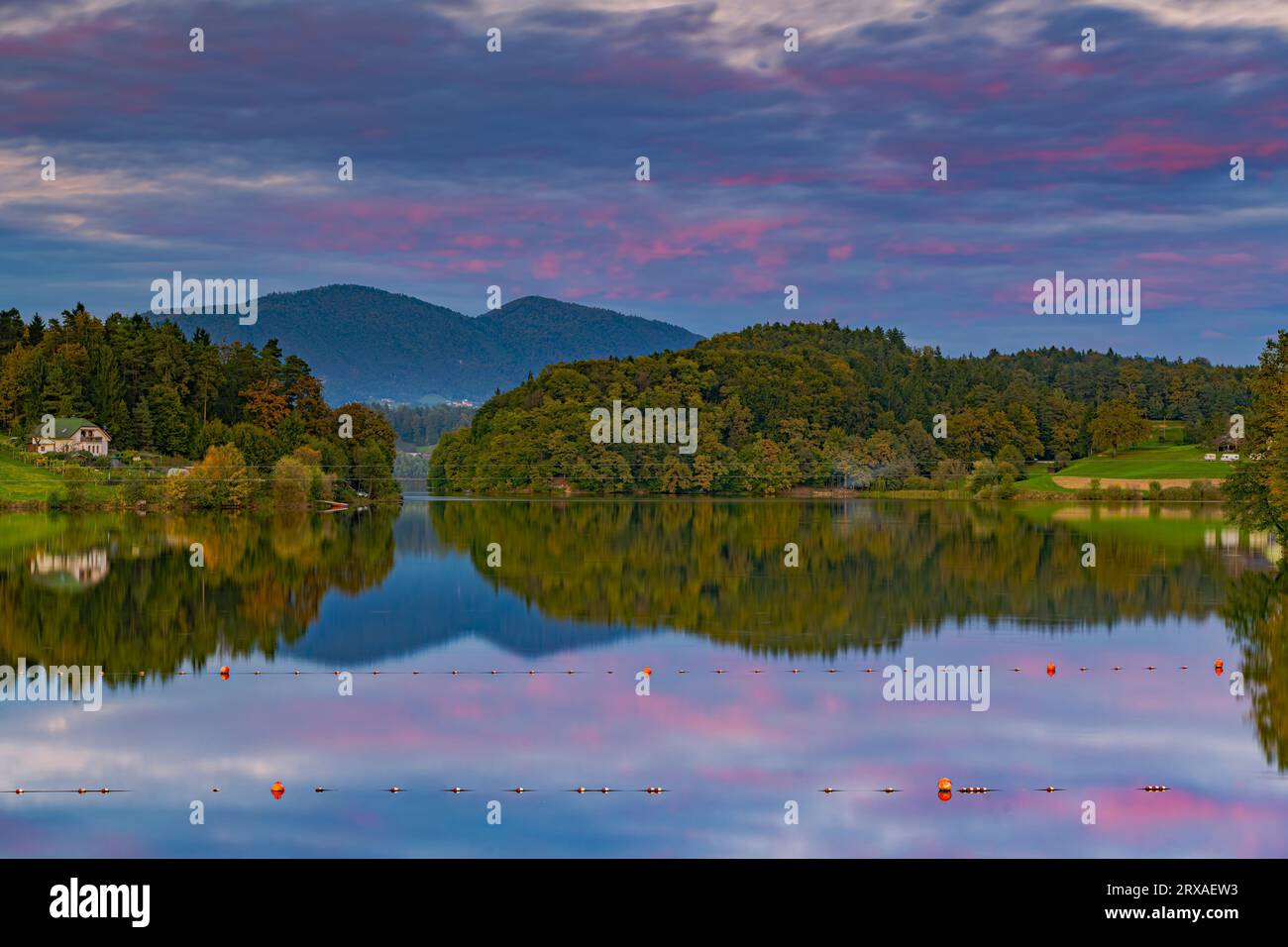 Misty lake with magic reflection Stock Photo - Alamy