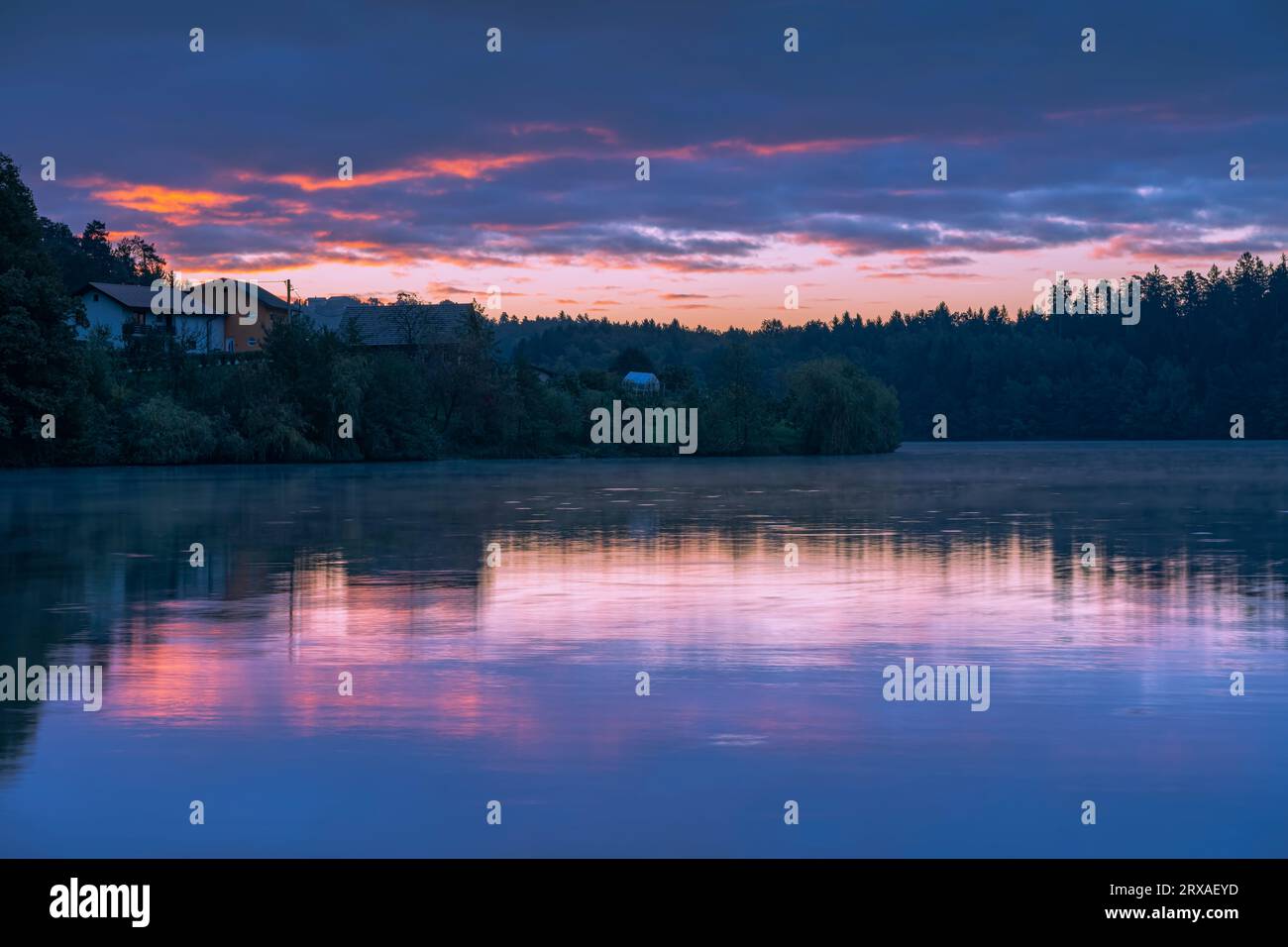 Misty lake with magic reflection Stock Photo - Alamy